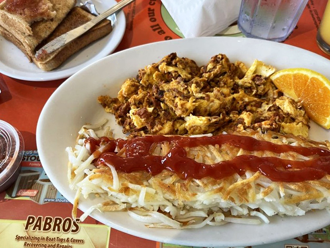 This isn't just breakfast&mdash;it's a masterpiece of textures where crispy hash browns meet scrambled eggs in perfect harmony.