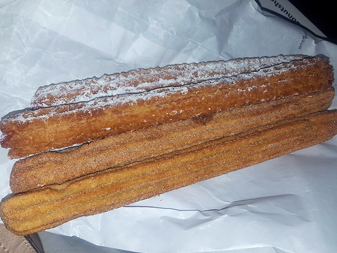 Cinnamon-sugar churros that crunch then yield, proving that sometimes the simplest pleasures are the most profound.