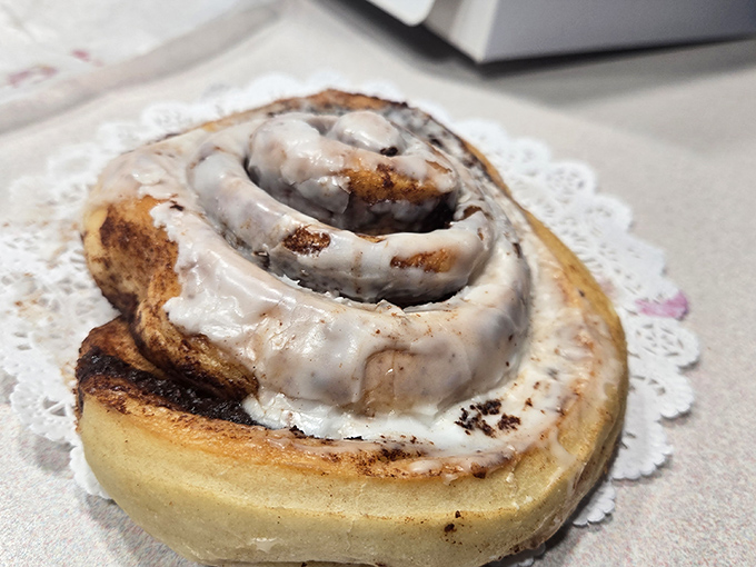 The cinnamon roll doesn't need to be the size of your head, but it is anyway. That's the kind of commitment we should all aspire to.