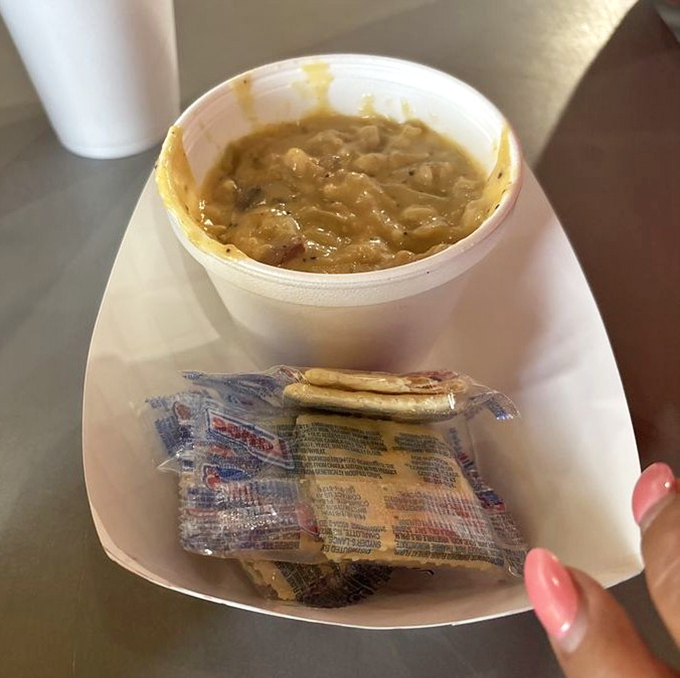The legendary clam chowder arrives with crackers standing by. One spoonful and you'll understand why people drive for hours just for this bowl.