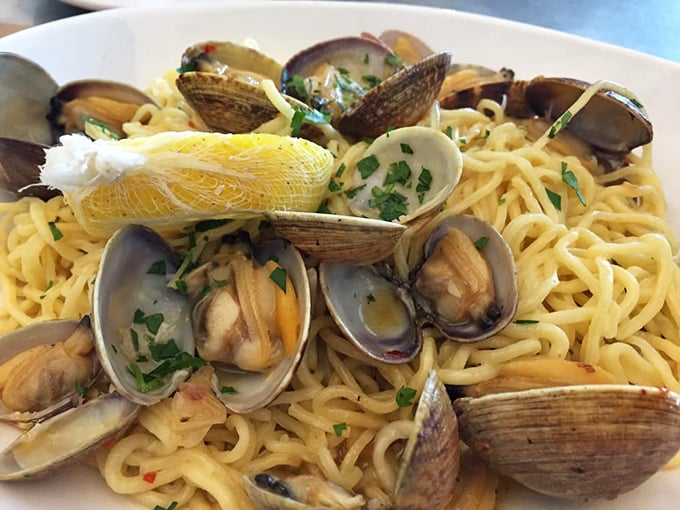 Linguine with clams&mdash;where pasta meets ocean. Those shells aren't just decoration; they're little treasure chests delivering briny surprises with each twirl of your fork.