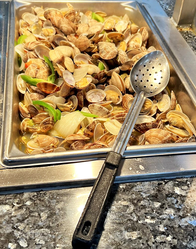 Clams by the dozens, ready for their moment of glory. The seafood section at Kumi doesn't mess around.