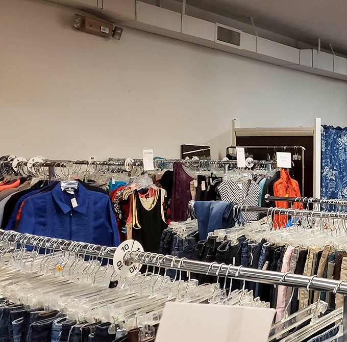 Racks upon racks of color-coded clothing await treasure hunters. That vibrant blue button-down might just be your next lucky interview shirt!