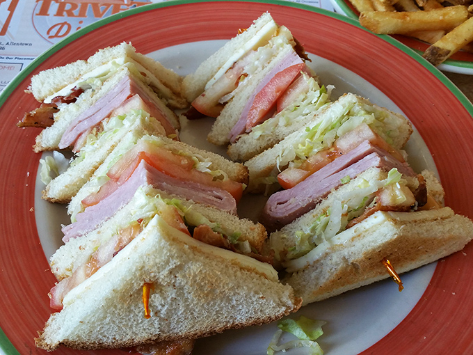 The legendary club sandwich, stacked higher than your unread emails, with each layer playing its part in the symphony of flavors that justifies the drive to Allentown.