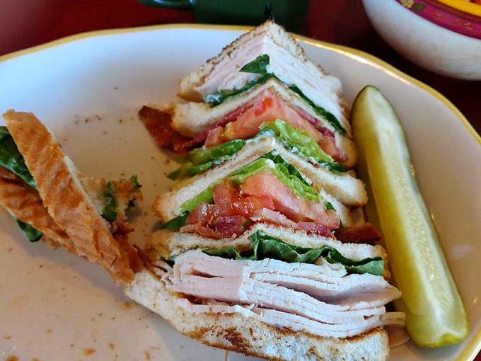 Club sandwich architecture at its finest &ndash; layers of goodness that would make Frank Lloyd Wright proud of this edible masterpiece.