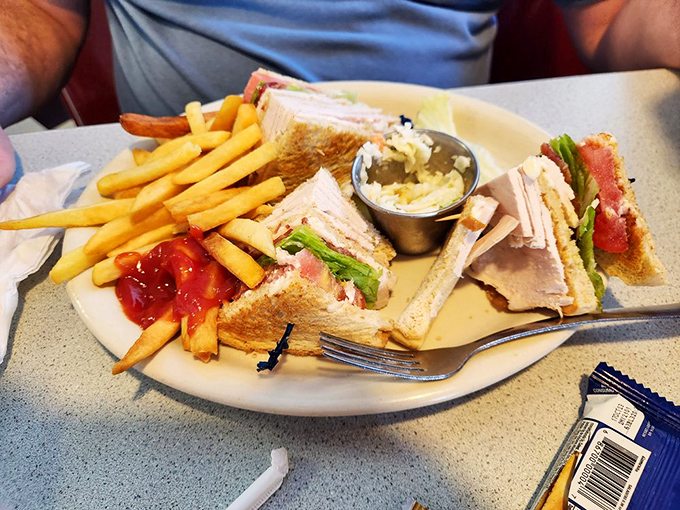 The club sandwich arrives like architectural perfection &ndash; layers of goodness that would make Frank Lloyd Wright jealous.