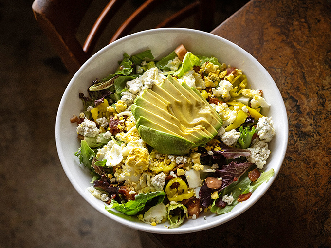 A salad that actually excites! Those perfect avocado slices are nature's butter, making even the healthiest option feel indulgent.