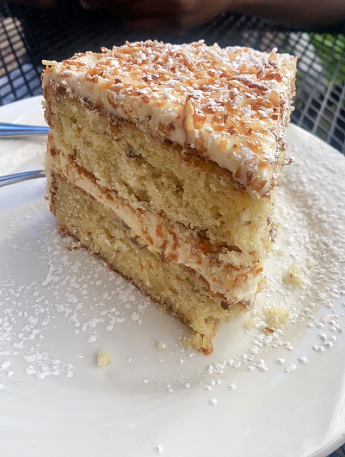 Layer upon layer of coconut cake perfection. The kind of dessert that makes you consider skipping the entr&eacute;e entirely.