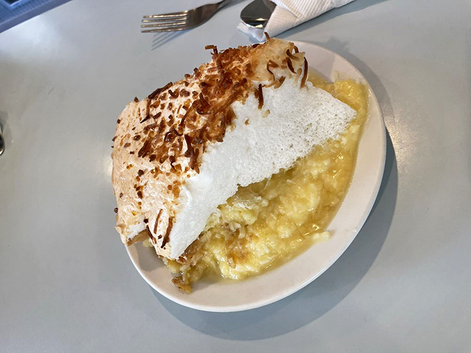 Coconut cream pie with a toasted top that would make any dessert lover weak at the knees. This isn't just dessert&mdash;it's therapy.