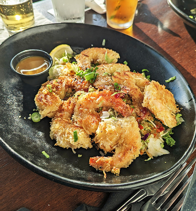Coconut shrimp that delivers on its promises. Crispy, golden morsels arranged like a crown, with dipping sauce fit for royalty.