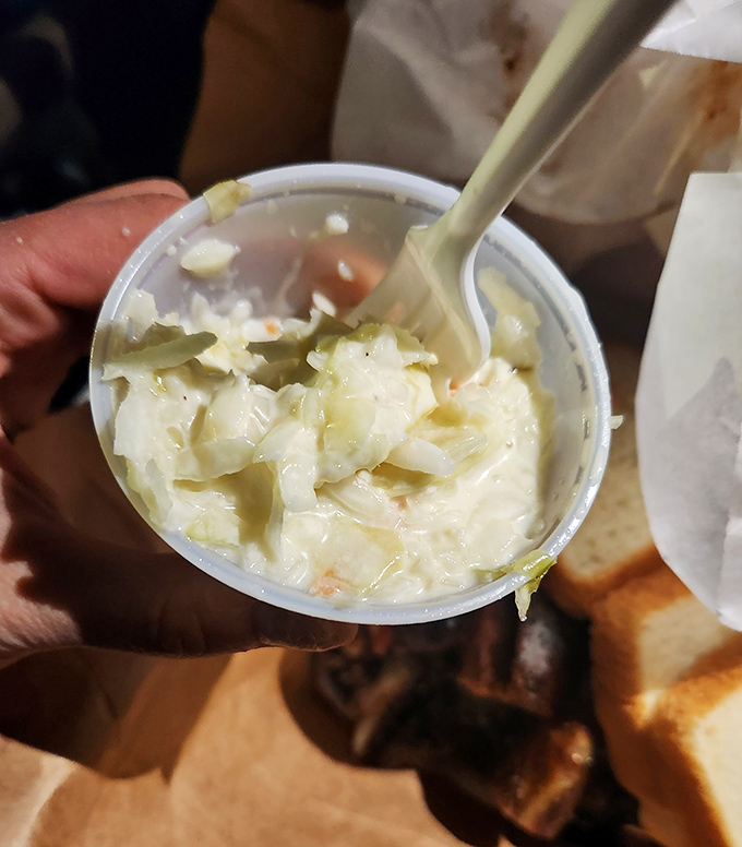 Lem's coleslaw isn't an afterthought&mdash;it's the cool, creamy counterpoint that your taste buds didn't know they needed until now.