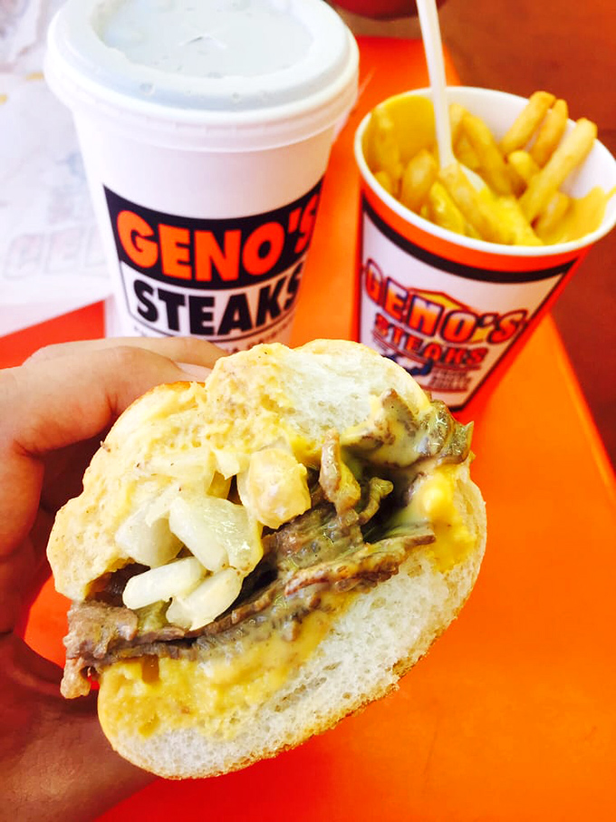 The holy trinity of Philly dining: a perfectly constructed cheesesteak, golden fries, and a cold drink. Comfort food nirvana achieved.