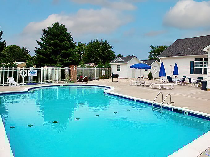 The community pool: where "I'm just going for a quick dip" turns into three hours of gossip, sunshine, and forgetting what time it is.