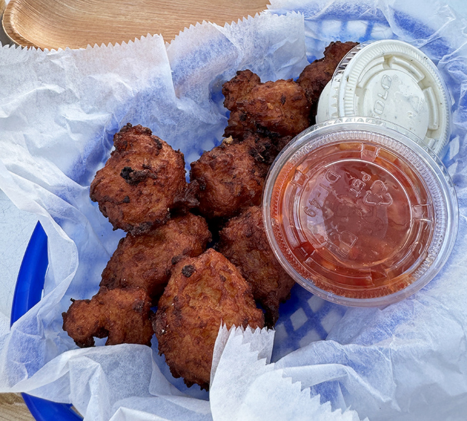 Conch fritters &ndash; little hush-puppy-like spheres of the sea that deliver a satisfying crunch before revealing their tender, flavorful interior.