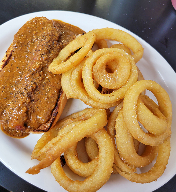 Meatloaf with onion rings&mdash;a partnership so perfect it makes you wonder why more diplomatic negotiations don't happen over plates of comfort food.