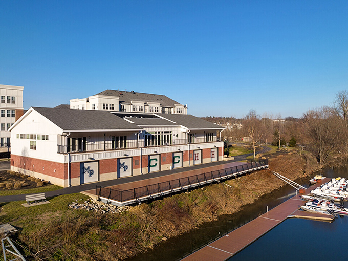 The Conshohocken Rowing Center perches riverside like a proud parent watching its athletes glide across the Schuylkill's surface.