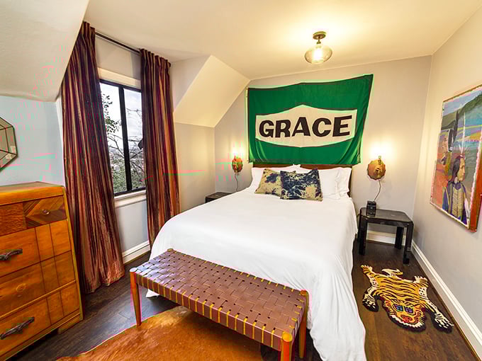 This bedroom's quirky charm comes with a side of personality&mdash;where else would you find a vintage gas station sign serving as unexpected headboard art?