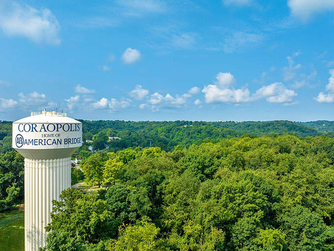 Home of American Bridge proclaims the water tower, standing tall above a canopy of trees that turn spectacular shades of crimson each fall.