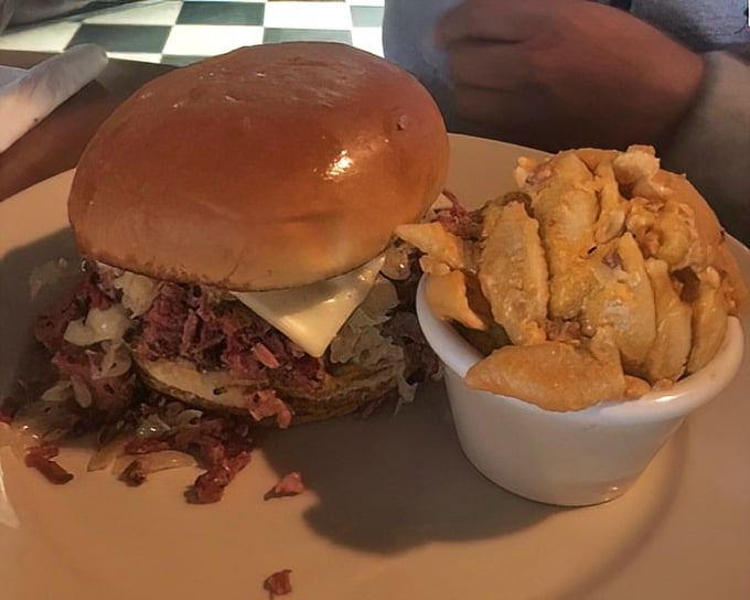 A sandwich that requires both hands and a strategy &ndash; note how the meat peeks out, practically winking at you with smoky promise.