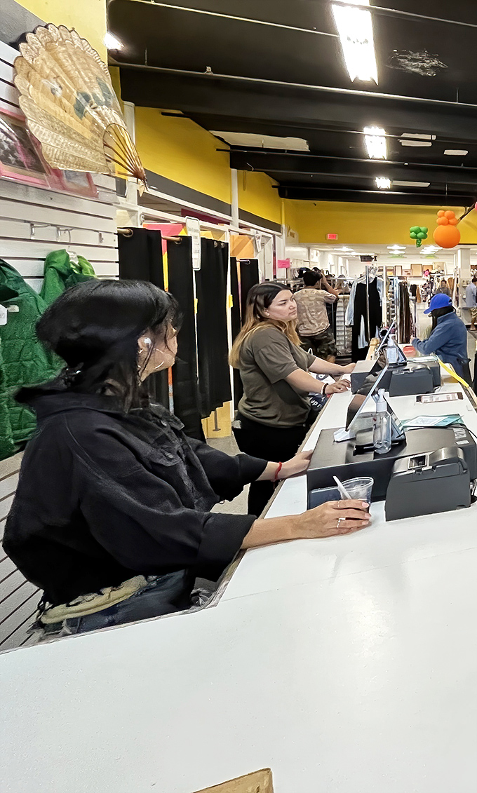 The checkout counter, where treasures are tallied and bargains become official. That decorative fan on the wall could be your next find!