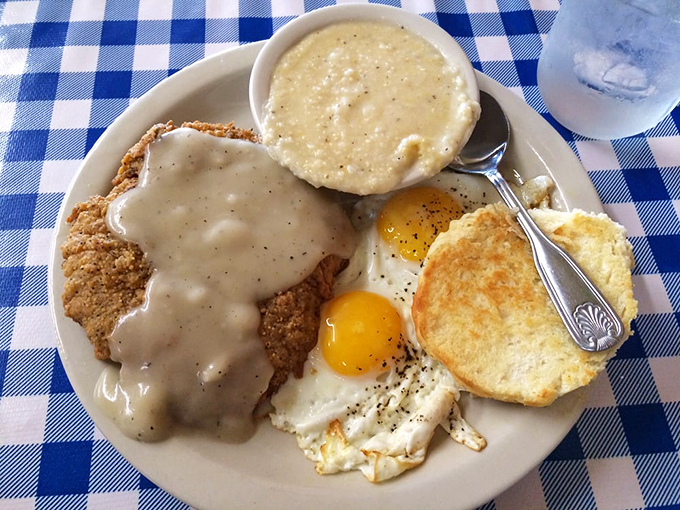 Country fried steak swimming in gravy with eggs and grits&mdash;the breakfast equivalent of hitting the Southern comfort jackpot.