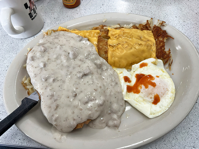 Country fried steak swimming in peppery gravy&mdash;proof that breakfast can double as armor against whatever the day might throw at you.