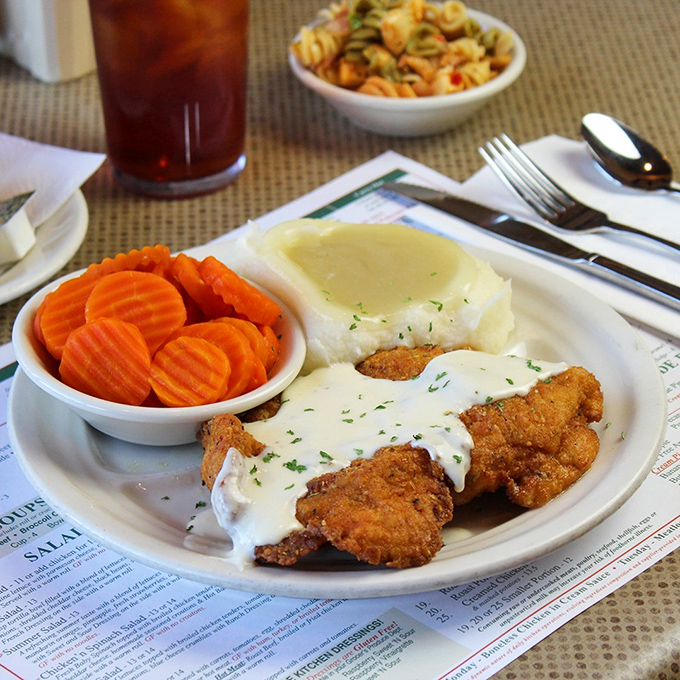 Country fried steak smothered in gravy with sides that make you understand why Midwesterners are so darn friendly&mdash;they're well-fed.