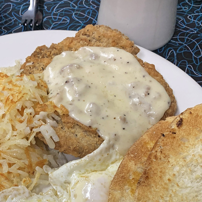 Country fried steak with gravy so good you'll want to write home about it. Comfort food that hugs your soul while simultaneously plotting against your arteries.