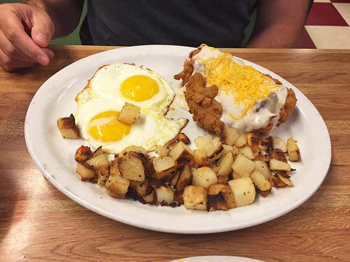 Breakfast meets dinner in this country-fried chicken and eggs plate&mdash;a hearty feast that says "you might want to cancel your afternoon plans."