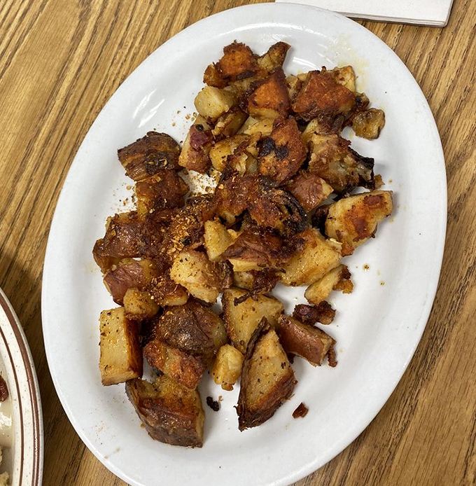 Country potatoes seasoned to golden-brown perfection – the unsung heroes of breakfast that deserve their own fan club.