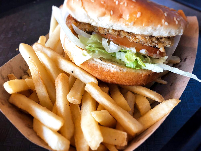 A seafood sandwich that demands two hands and zero shame. Diet plans were made to be broken for moments like this.