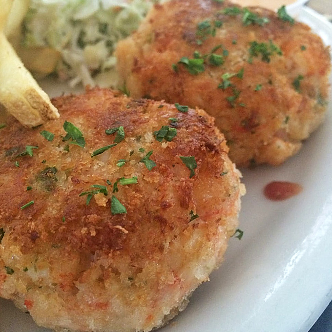 Golden on the outside, heavenly on the inside. These crab cakes aren't just appetizers&mdash;they're the opening act to a symphony of seafood.