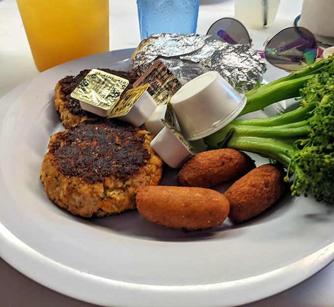 The crab cake that launched a thousand road trips &ndash; perfectly seared, minimal filler, and paired with hush puppies that could make a Southerner weep with joy.