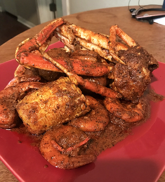 A mountain of seasoned crab legs and corn that says, "Cancel your next appointment &ndash; you'll be here a while."