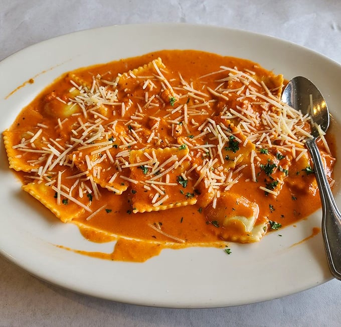 Ravioli swimming in a sunset-colored sauce – proof that pasta and seafood were meant to be together like Bogart and Bacall.