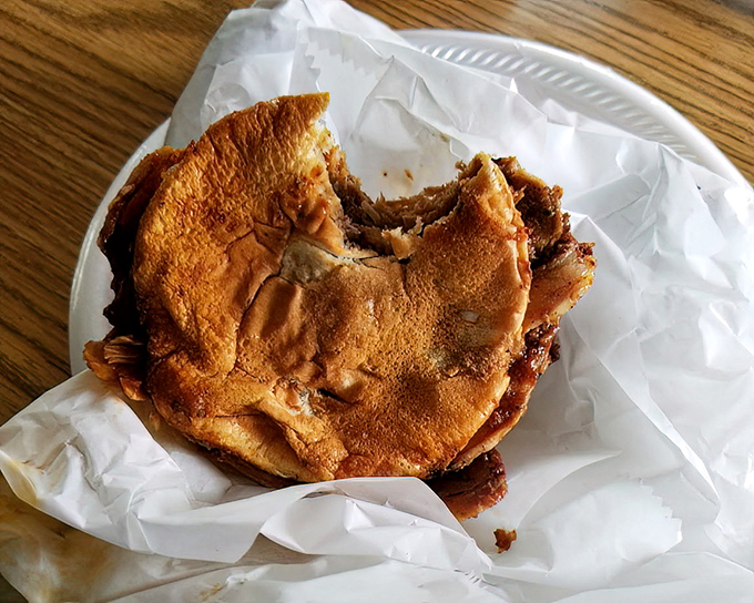 Behold the BBQ sandwich in its natural habitat&mdash;simple white bread embracing meat that's been coaxing flavor from smoke for hours.
