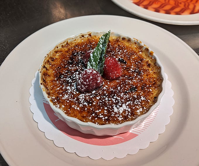 The cr&egrave;me br&ucirc;l&eacute;e's crackling sugar top gives that satisfying "tap-tap-crack" that's basically percussion for your dessert course.