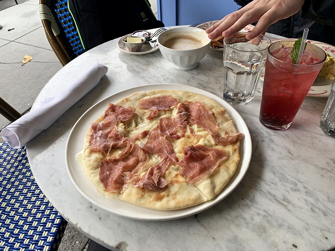 Crescenza-Stuffed Focaccia that makes you wonder why you ever bothered with pepperoni. Paired with that ruby-red cocktail, it's a match made in culinary heaven.