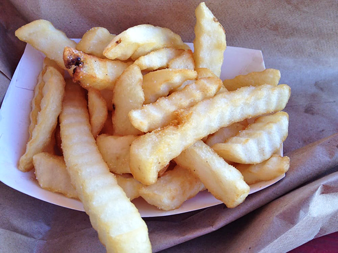 Golden crinkle-cuts that remember when fries were fries and nobody complained about it.