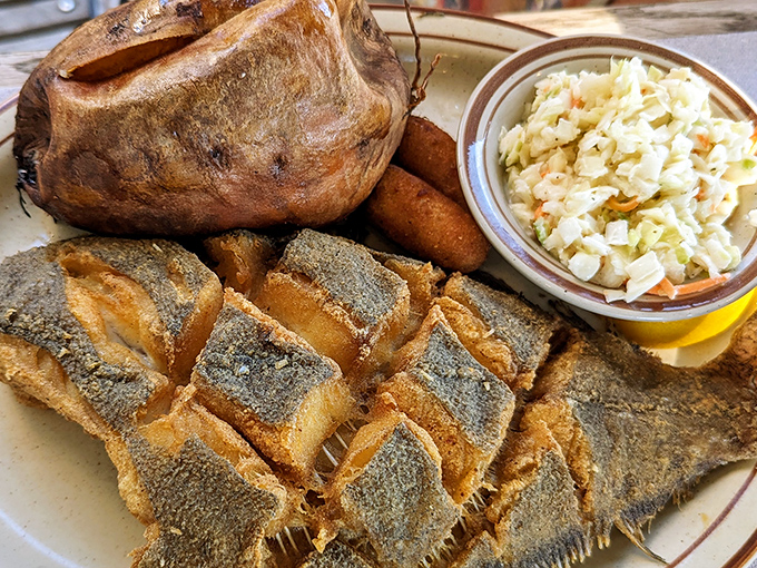 Crispy flounder that's been cornmeal-kissed to golden perfection, served with the kind of sides that make you rethink your relationship with vegetables.