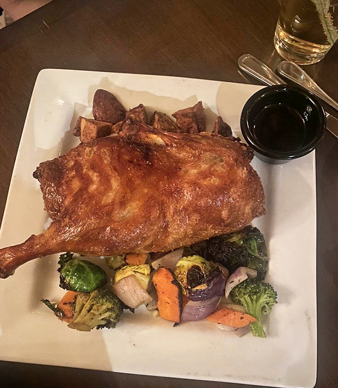 Golden crispy duck that arrives looking like it just stepped out of a culinary magazine photoshoot.