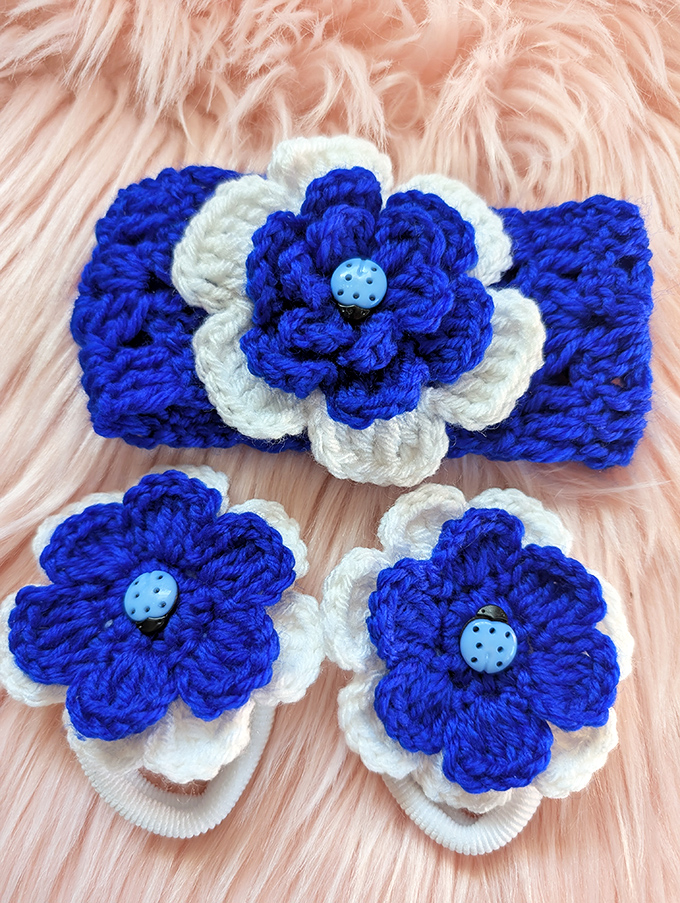 Handcrafted blue flower accessories that would make Etsy artisans jealous. Someone's grandmother is seriously talented with a crochet hook!