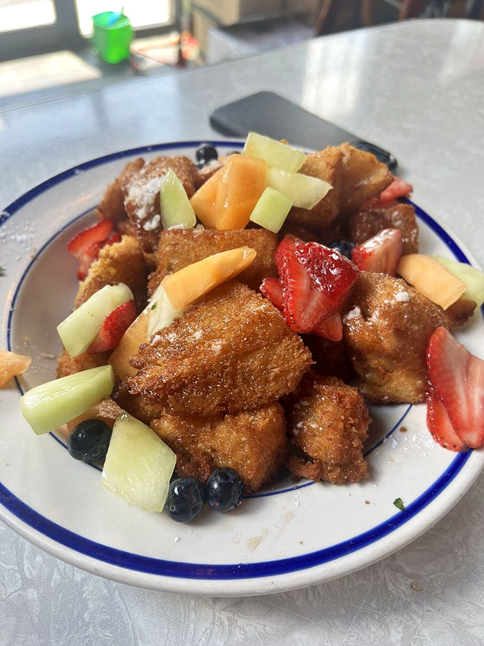 This isn't just French toast &ndash; it's Cuban French toast with fresh fruit that transforms breakfast into an art form. Crispy, sweet perfection that would make Paris and Havana proud.