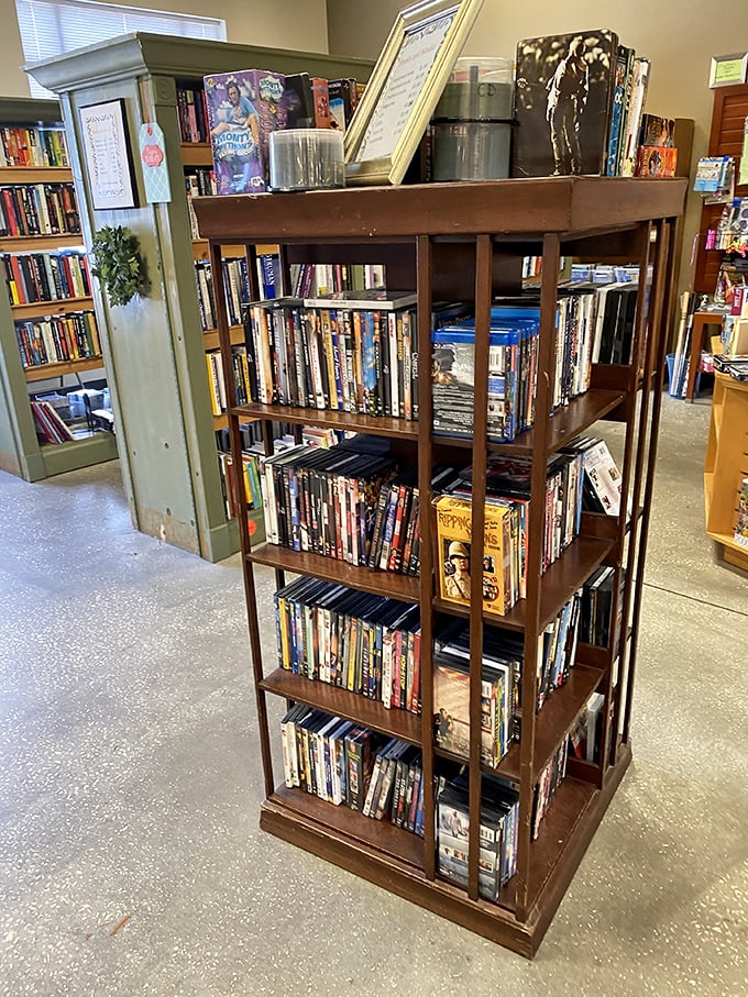 A bibliophile's dream corner where DVDs and books stand ready for rainy day marathons and beach reading adventures.