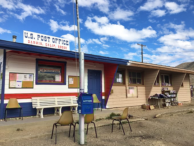 The post office doubles as town hall, community center, and probably the local dating scene. Blue trim never looked so official.
