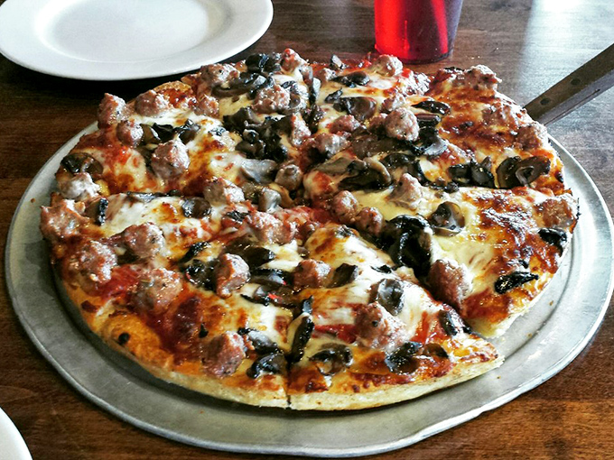 A pizza that doesn't know the meaning of "too much." Every inch covered with toppings, every bite delivering maximum flavor payload.