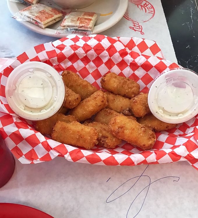 These golden-fried mac and cheese bites aren't just appetizers&mdash;they're little time machines that transport you back to childhood, only with better cheese.