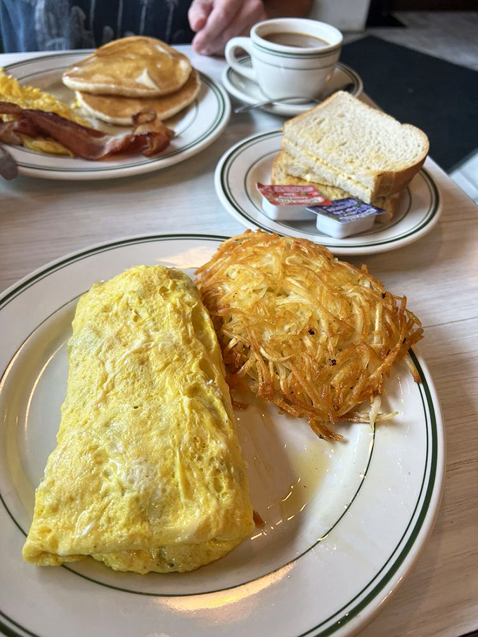 The Denver omelet with crispy hash browns—a breakfast duo that's been together longer than most Hollywood marriages.