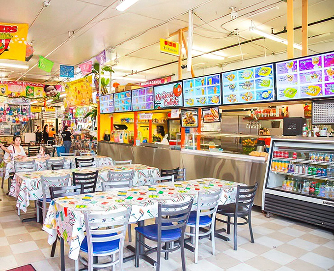 The food court's vibrant atmosphere and colorful tablecloths promise a flavor fiesta that makes chain restaurants seem as exciting as unseasoned oatmeal.