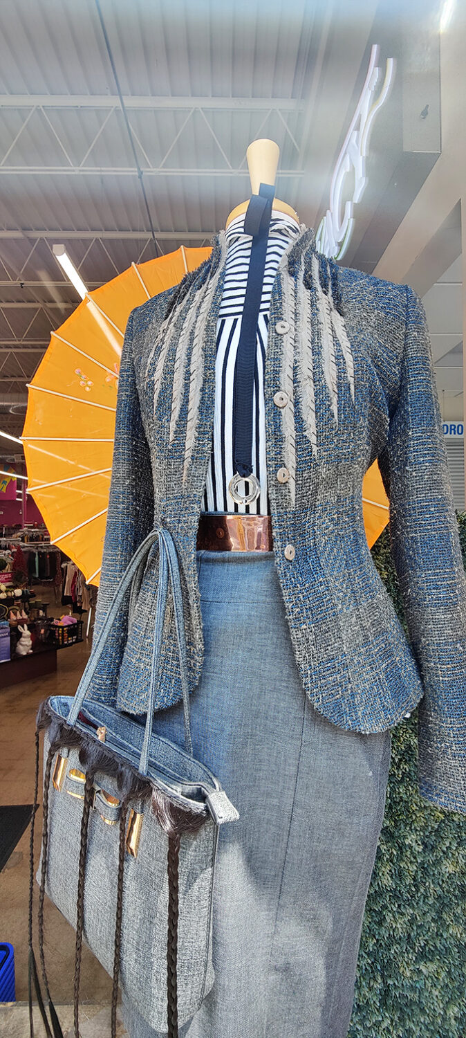 This mannequin isn't just wearing clothes&mdash;it's telling a story of sophisticated second chances with a tweed blazer that's seen more interesting places than most people.